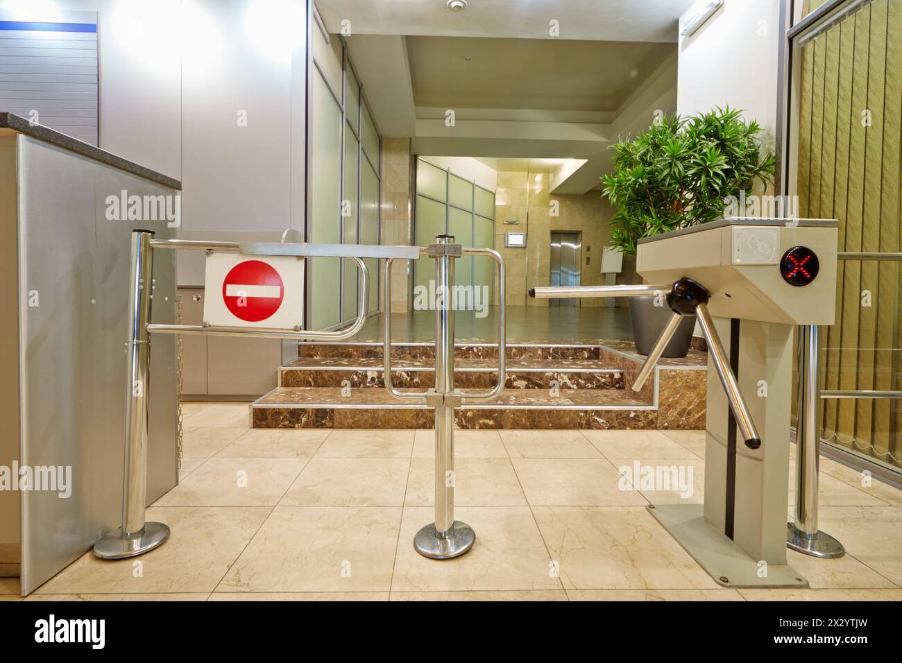 Entrance equipped with turnstile Stock Photo - Alamy