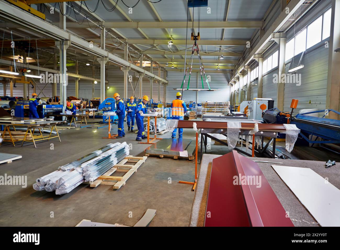 LOBNYA - JUN 7: Workers in manufacturing workshop at plant of Group of ...