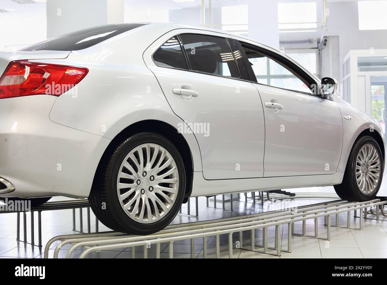 New white shining car stands in light office of shop selling cars Stock ...