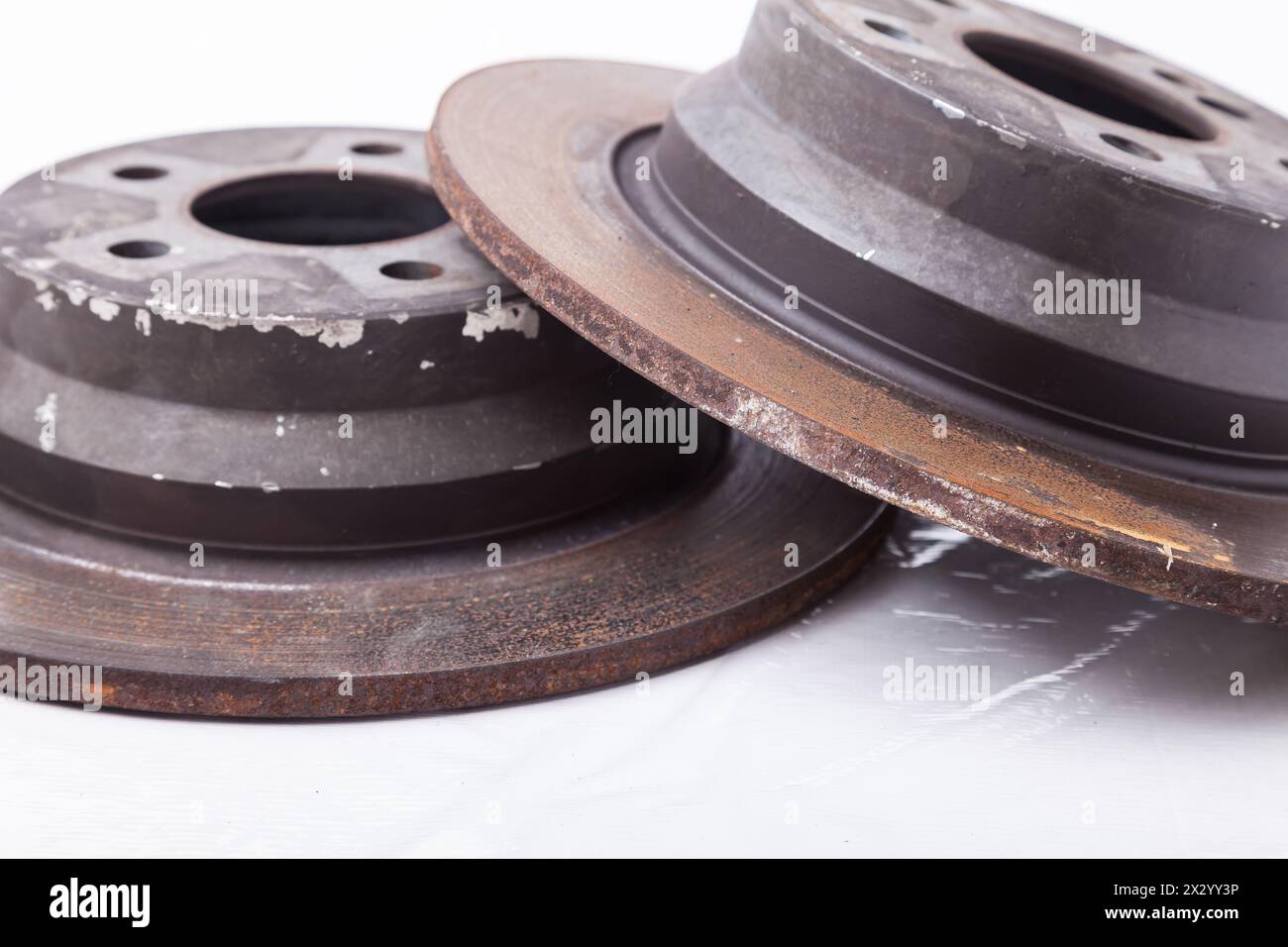 Old rusty brake disc on white background. Auto service industry. Spare ...
