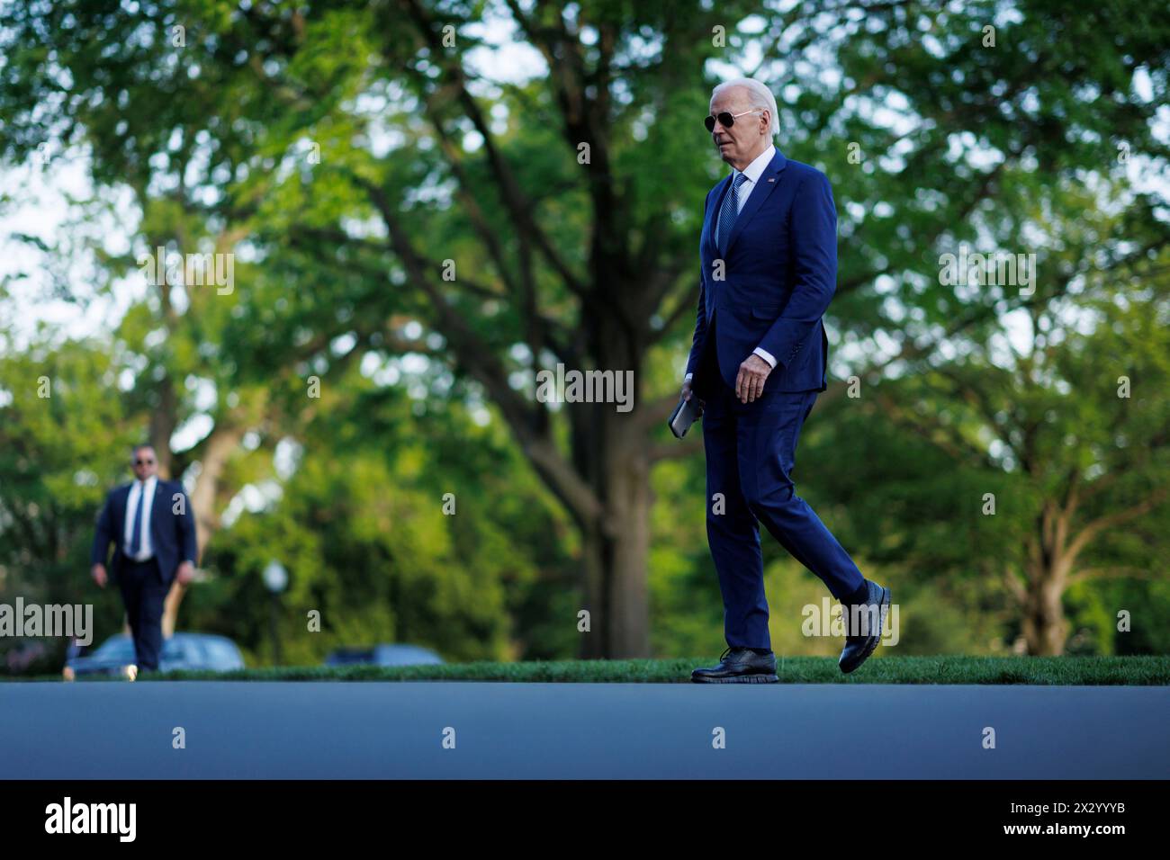 United States President Joe Biden walks on the South Lawn of the White ...