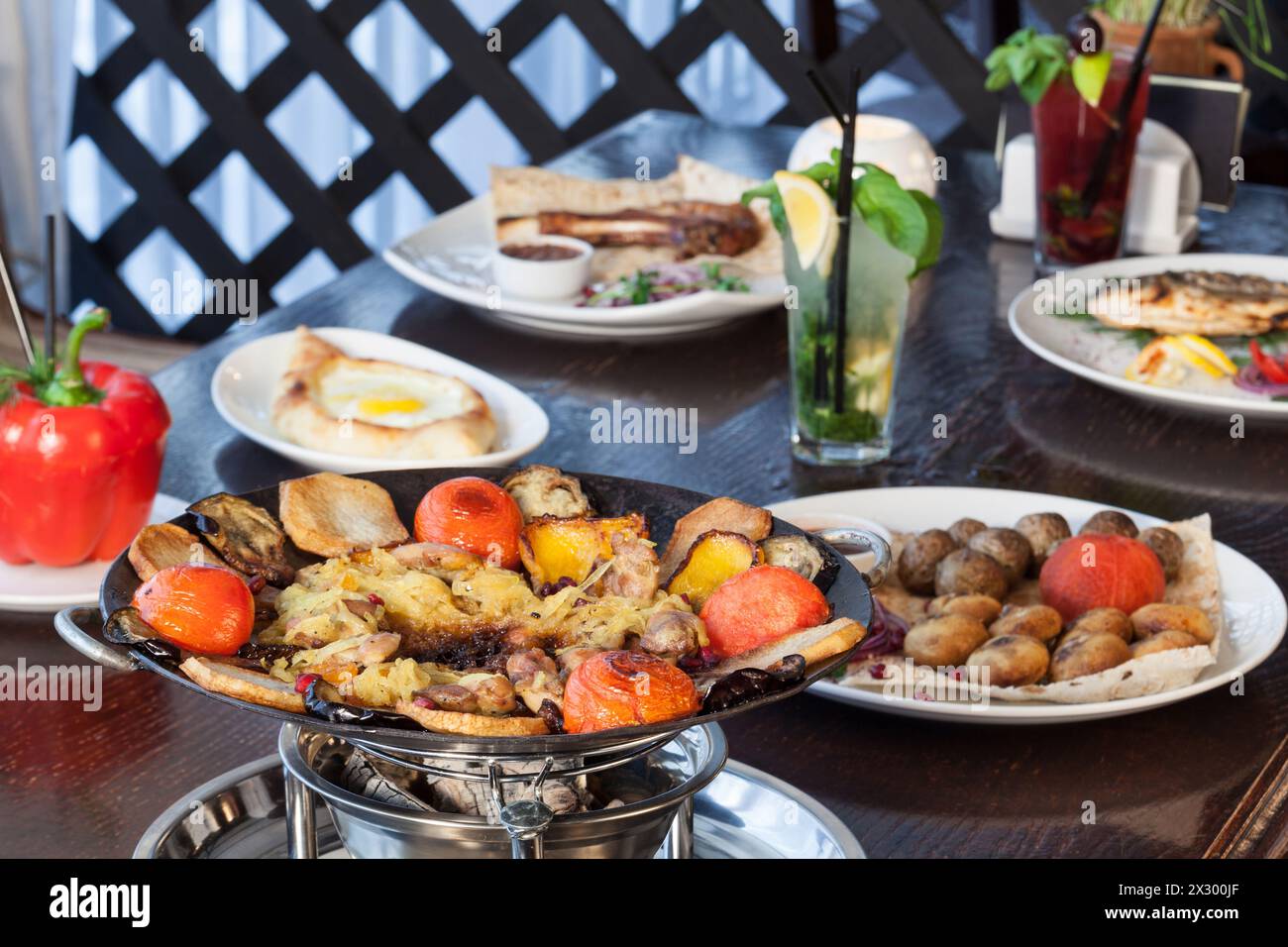 Beautifully set table with a different meal in the restaurant, close-up ...