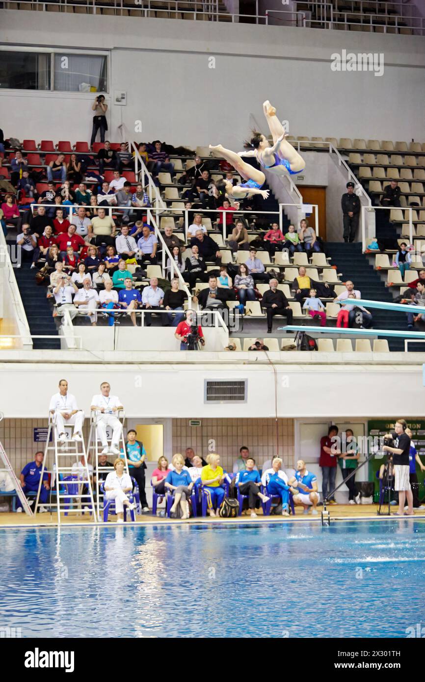 MOSCOW - APR 13: Two female athletes during competitions on syncronized ...