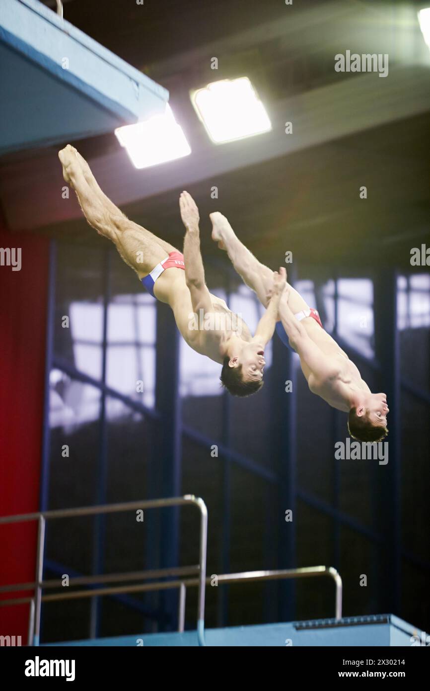 MOSCOW - APR 13: Athletes jump from tower at competitions on ...
