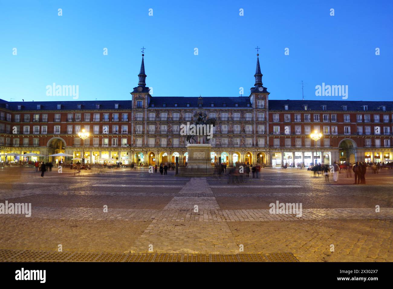 People walk near monument to Philip III Habsburg in Plaza Mayor at ...