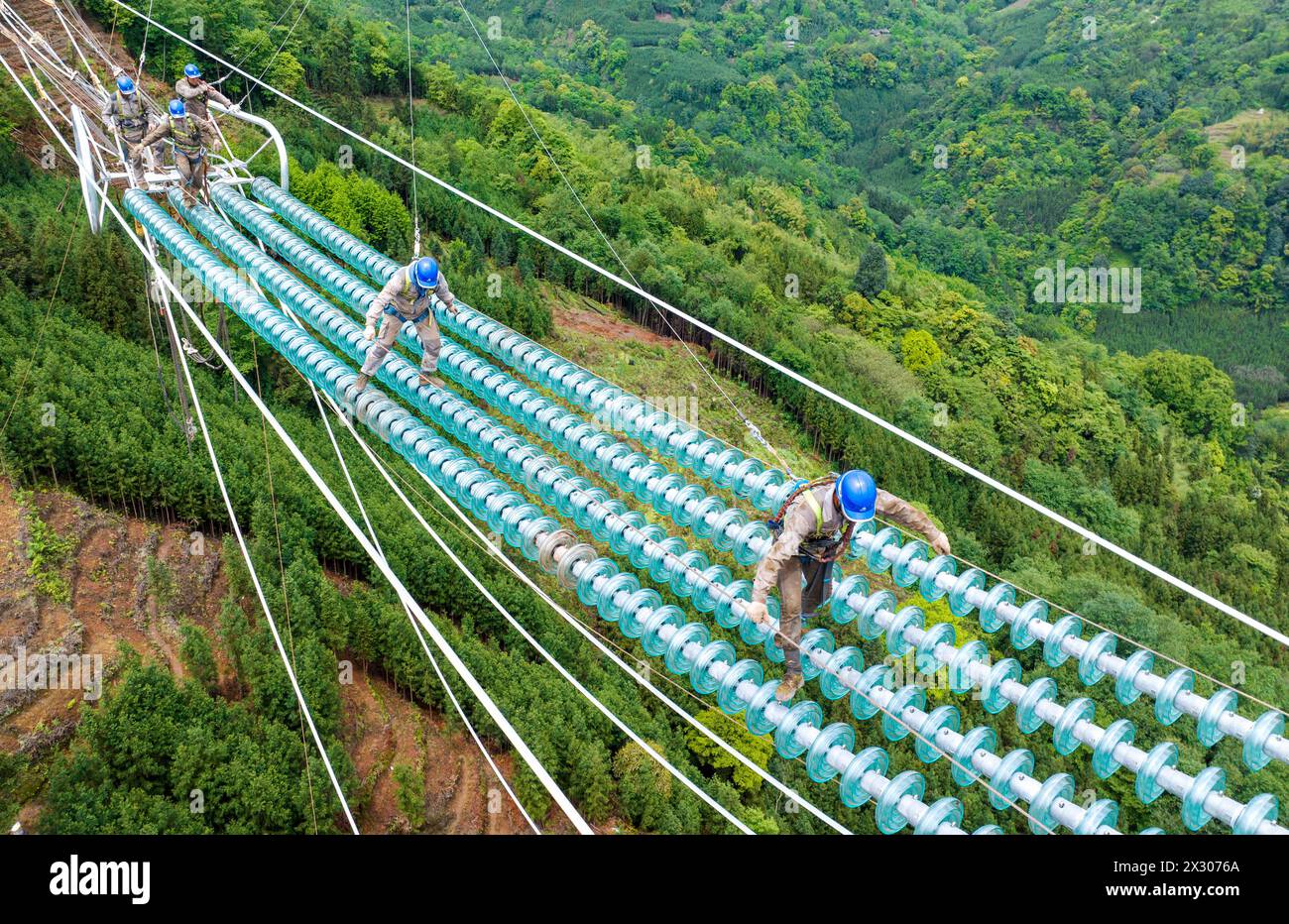 LESHAN, CHINA - APRIL 24, 2024 - Construction workers erect a À800 kV ...