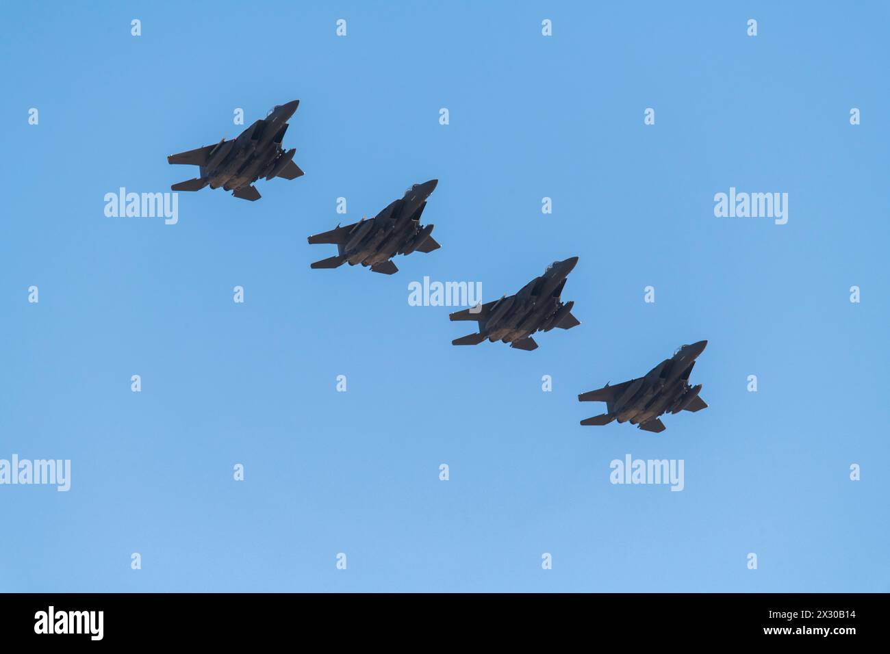 U.S. Air Force F-15E Strike Eagles fly overhead as they arrive at an ...