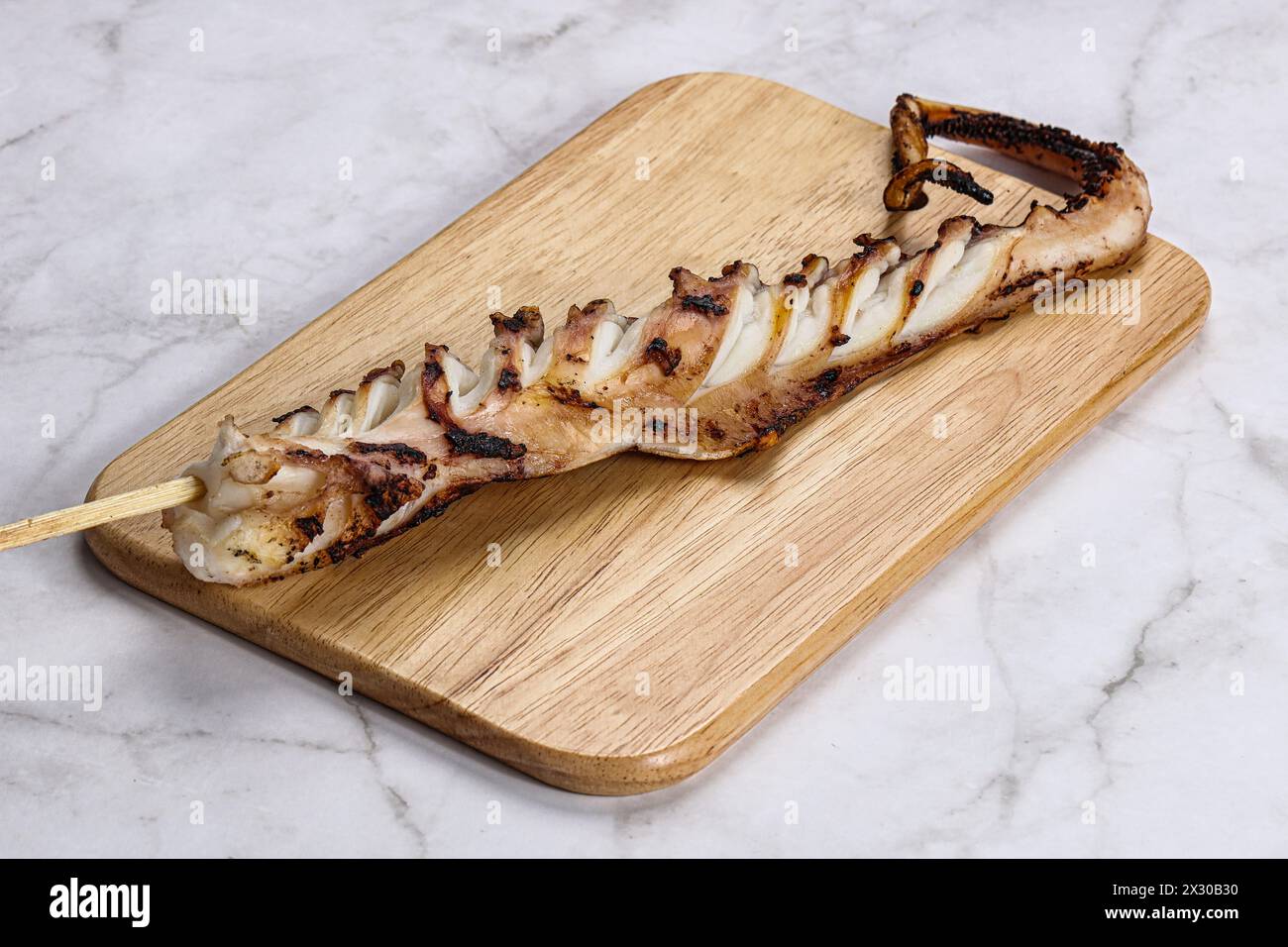 Delicous tasty Grilled octopus tentacle snack Stock Photo - Alamy