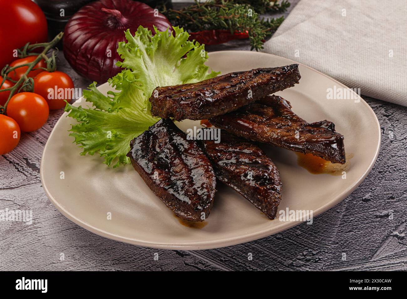 Grilled diet beef liver steak in the plate Stock Photo - Alamy
