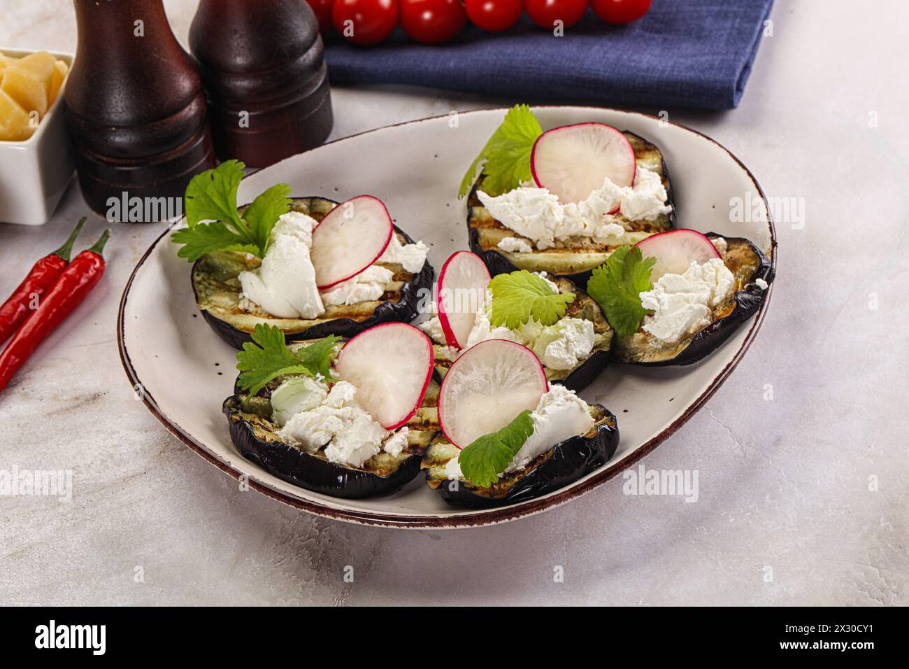 Grilled eggplant with cream cheese and radish Stock Photo - Alamy