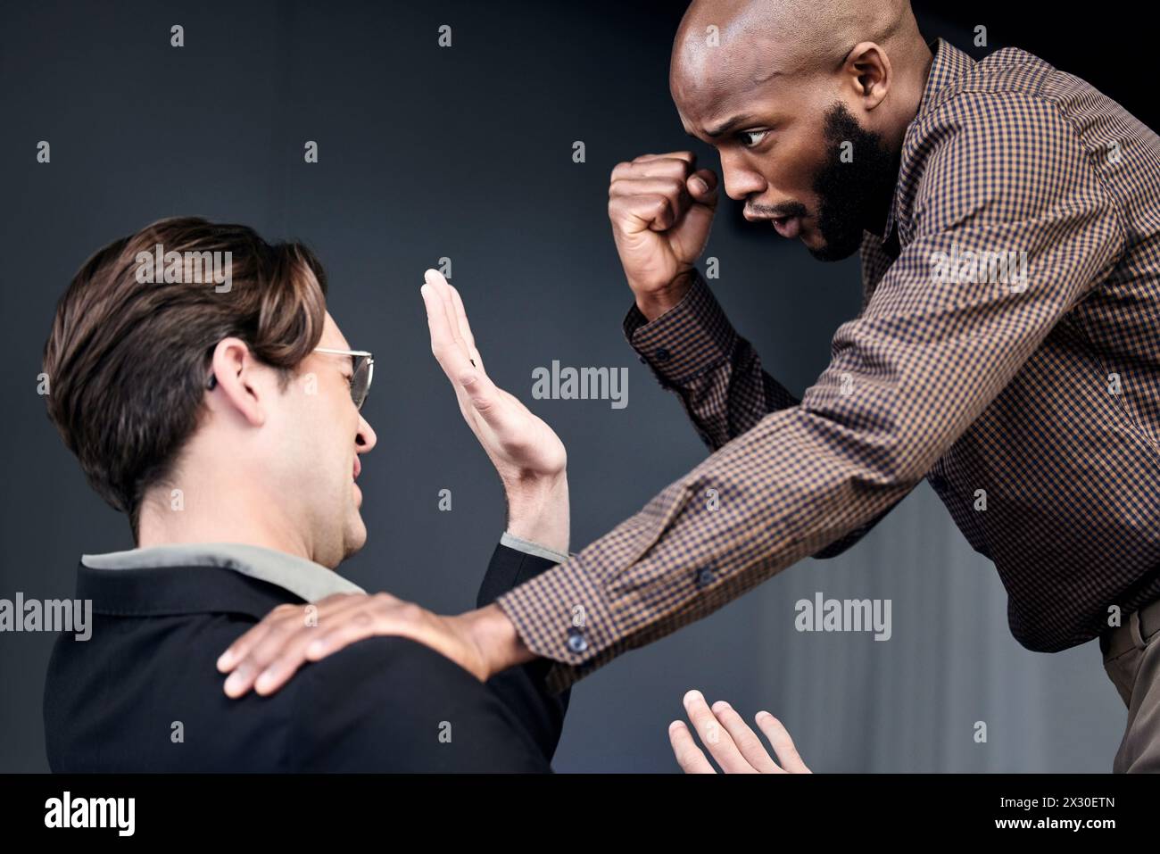 Angry, conflict and fight with business men in studio on dark ...