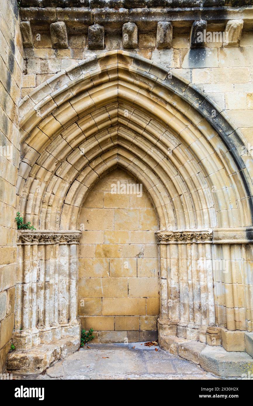 The abandoned medieval church portal with an archivolt. Church of Santa ...