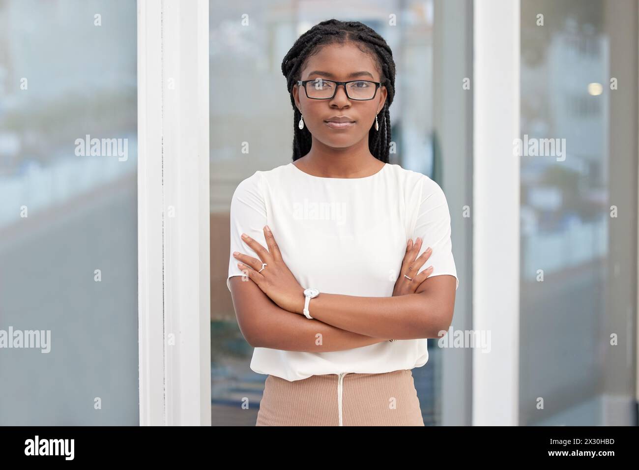 African businesswoman, portrait and office with arms crossed, proud and ...