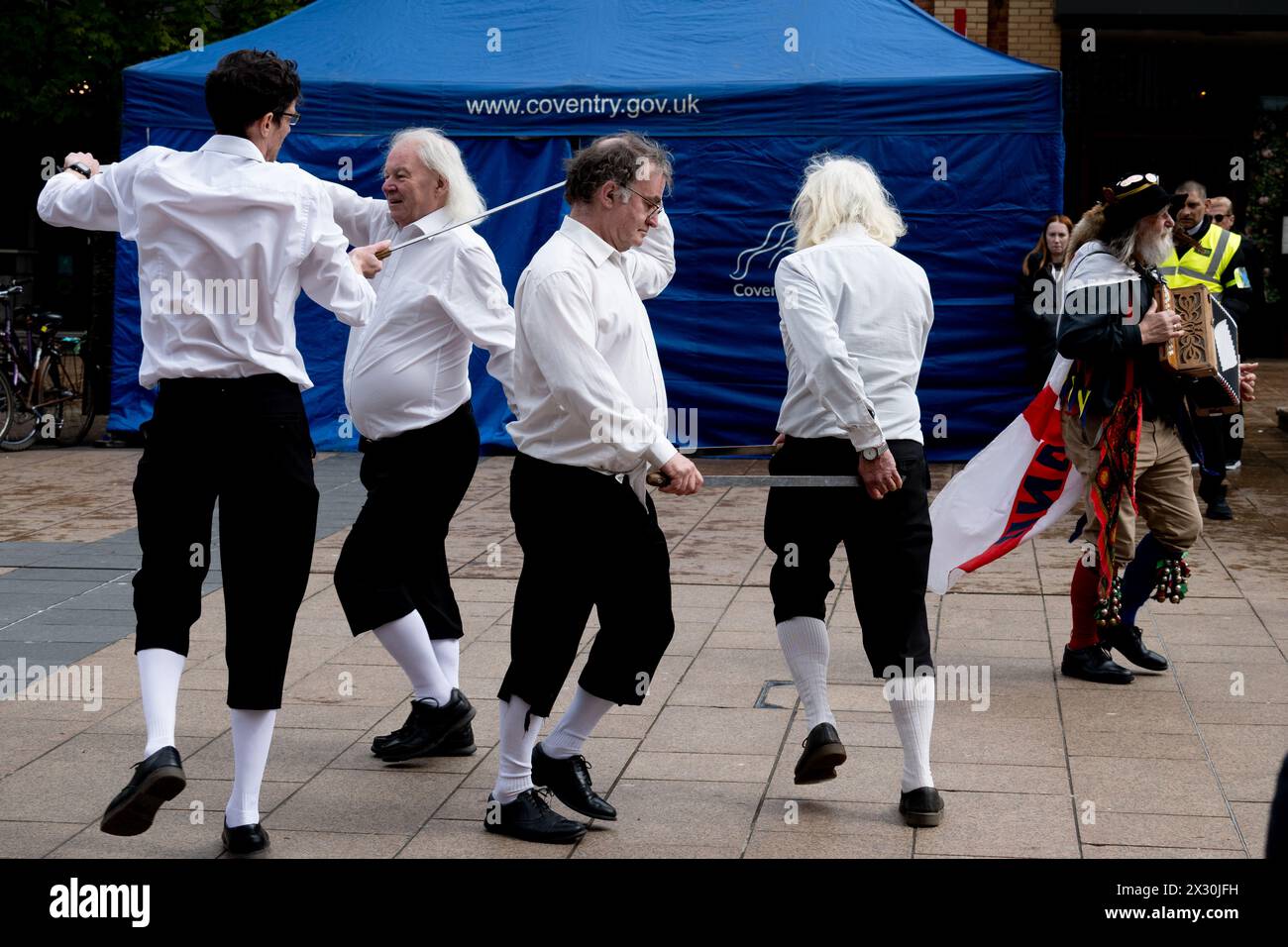 Morris dancers doing a sword dance, Coventry, UK Stock Photo - Alamy