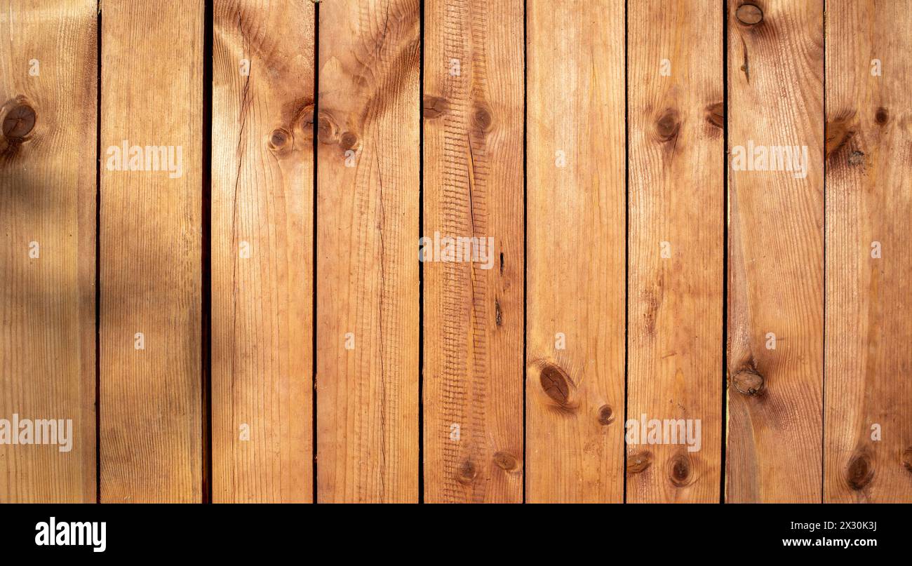 Close-up of natural wooden plank texture with warm tones and visible ...