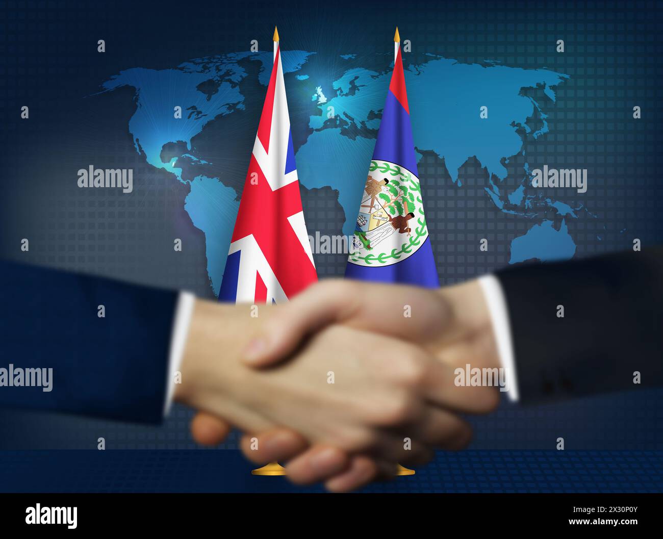 Two people shaking hands in front of Belize and UK flags Stock Photo ...