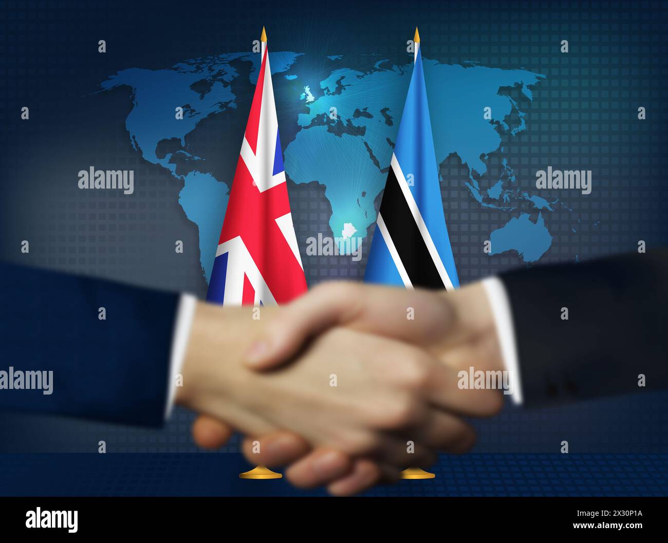 Two people shaking hands in front of Botswana and UK flags Stock Photo ...