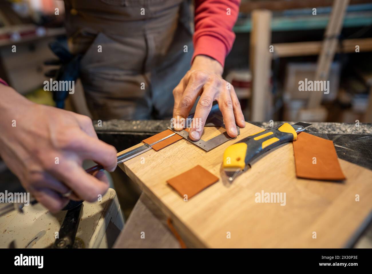 Male hands cutting leather skin. Master shoemaker cobbler professional ...