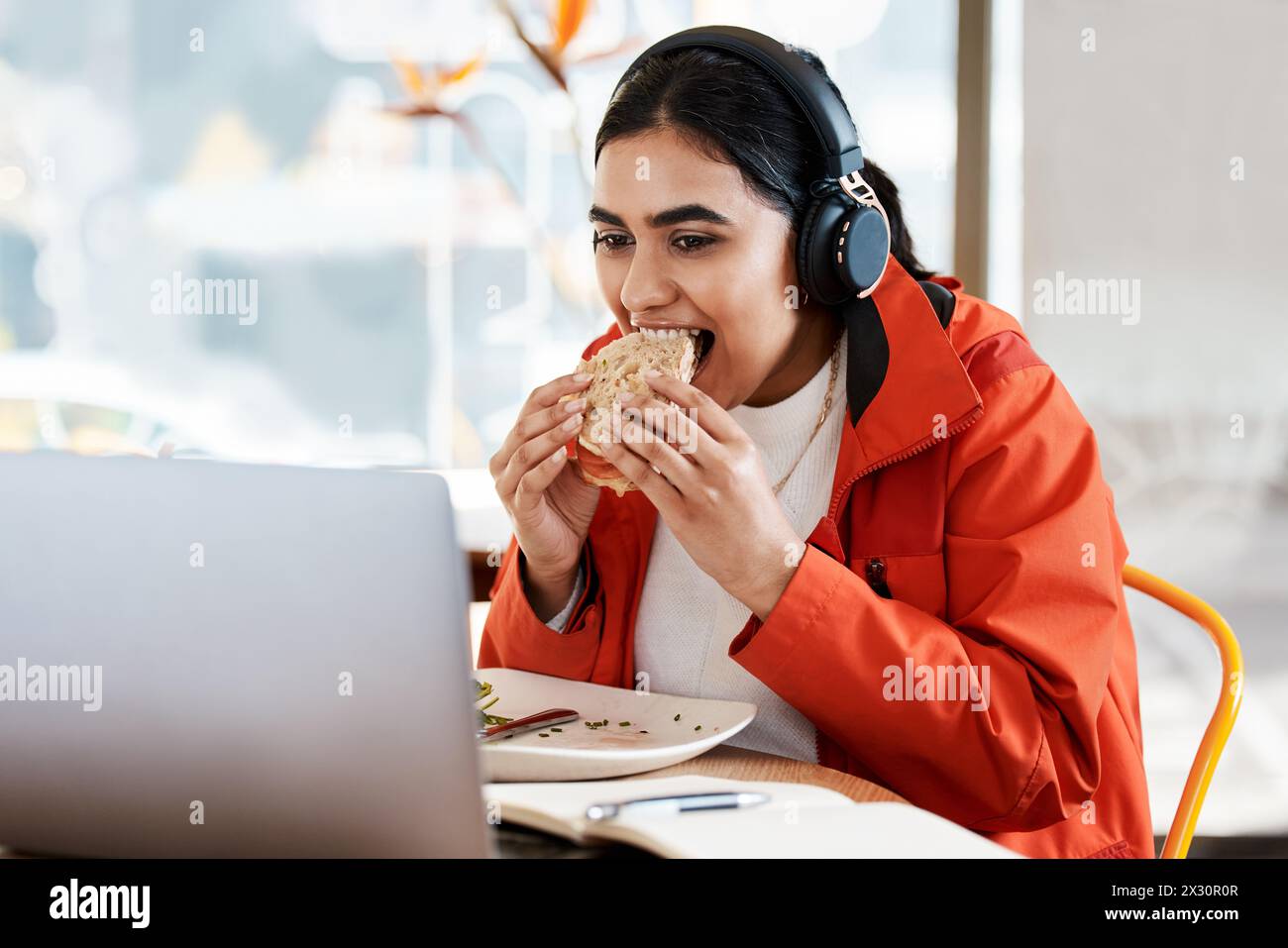 Woman, student and happy on laptop with burger for streaming platform ...