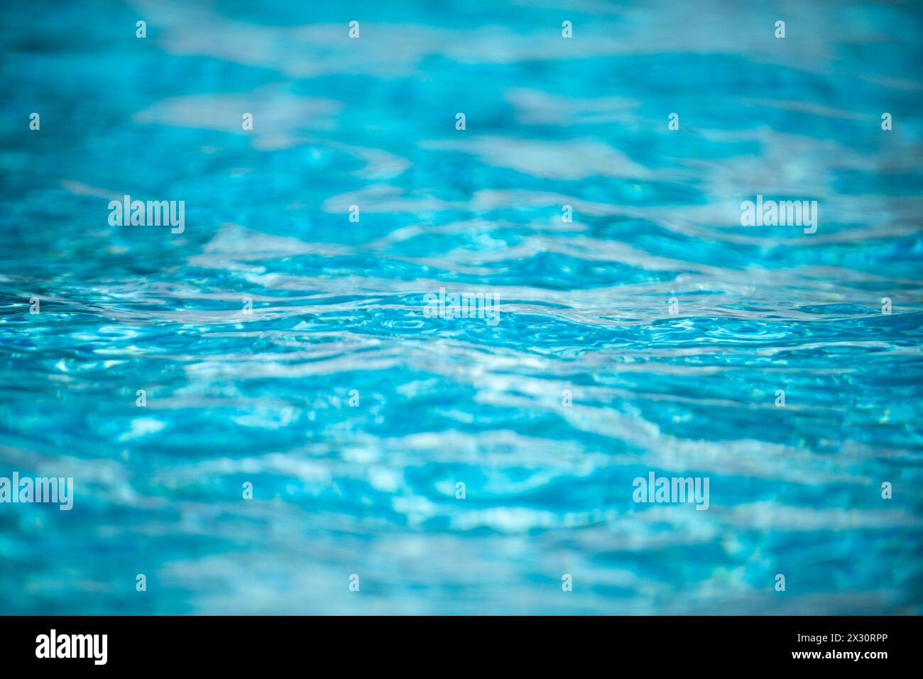 Water background. Blue water, ripples and highlights. Texture of water ...