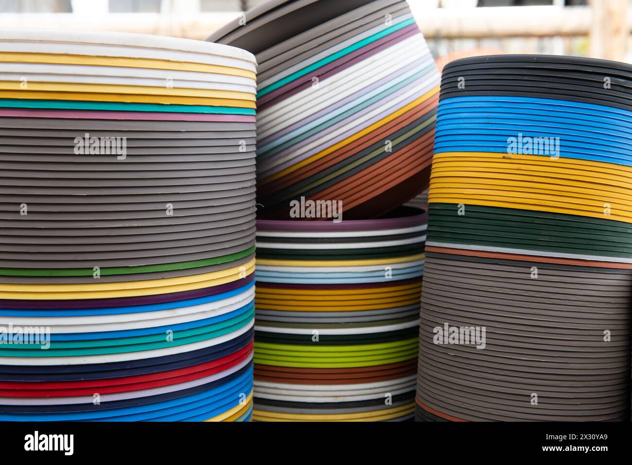 Multi-colored plastic plant containers stacked tightly in rows to form ... Multi-colored plastic plant containers stacked tightly in rows to form ...
