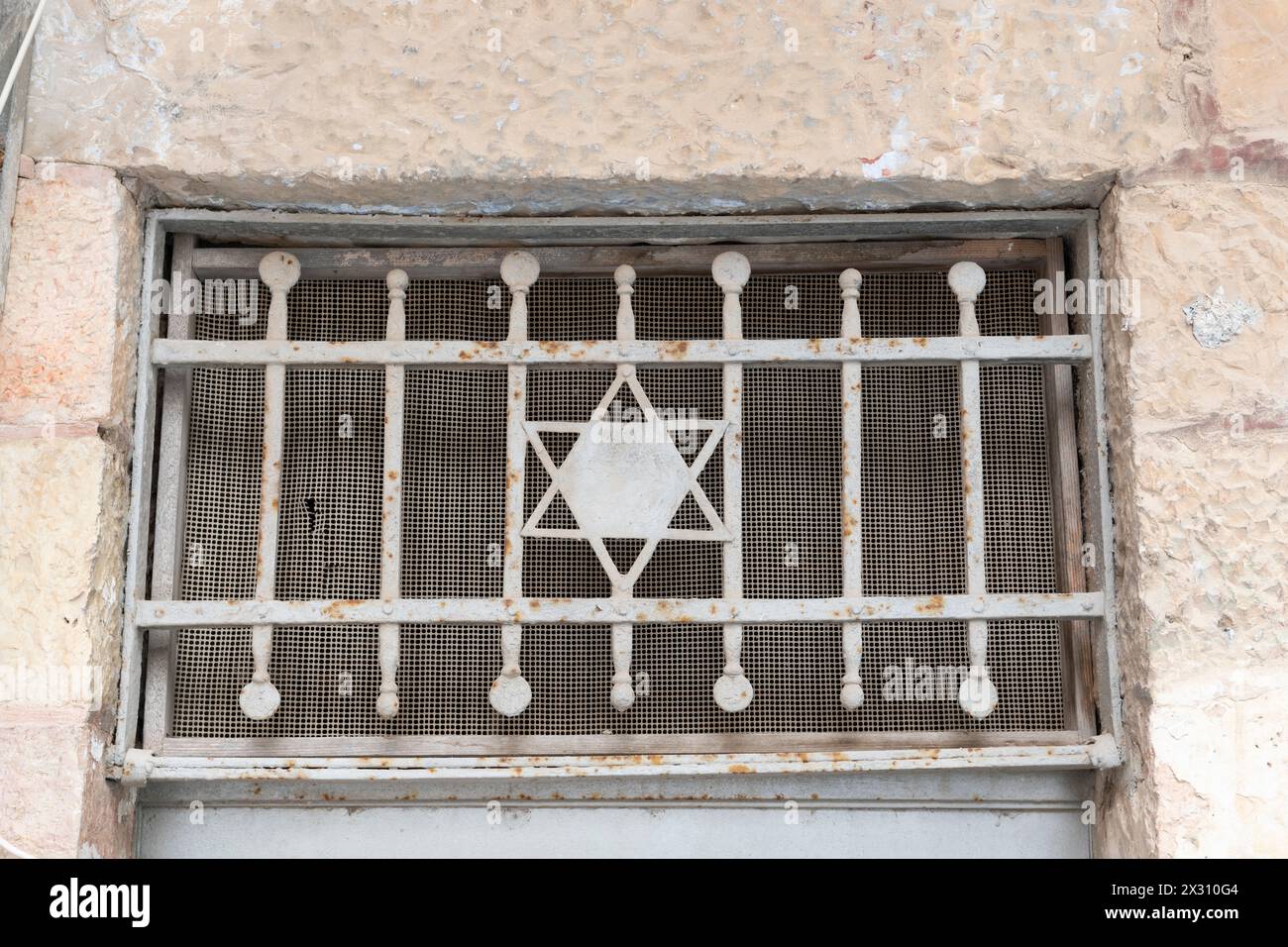 A small window in an old, Jerusalem apartment building in the Mea She ...