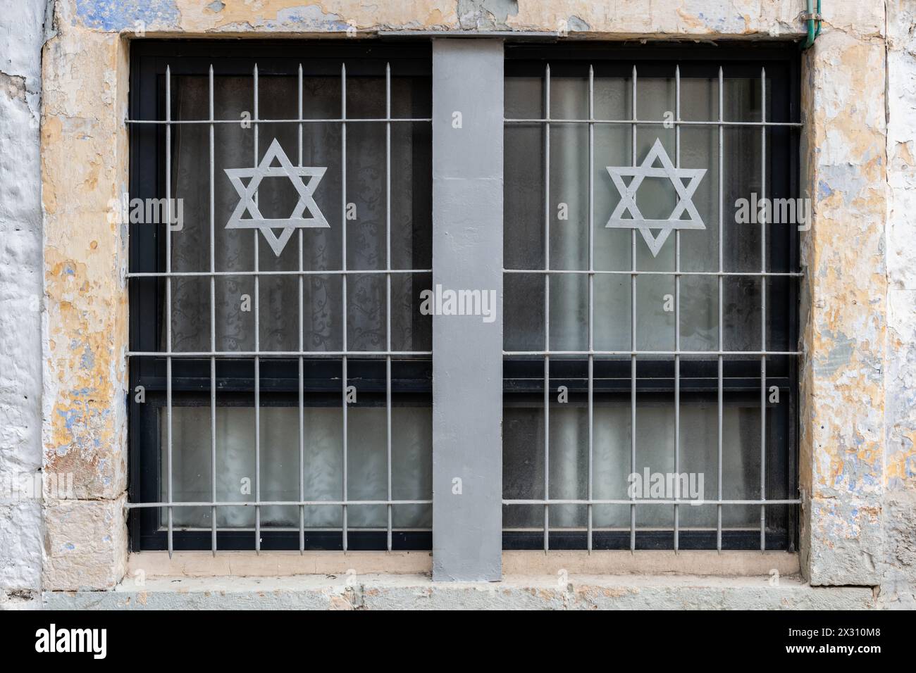 A pair of windows in an old, Jerusalem apartment building in the Mea ...