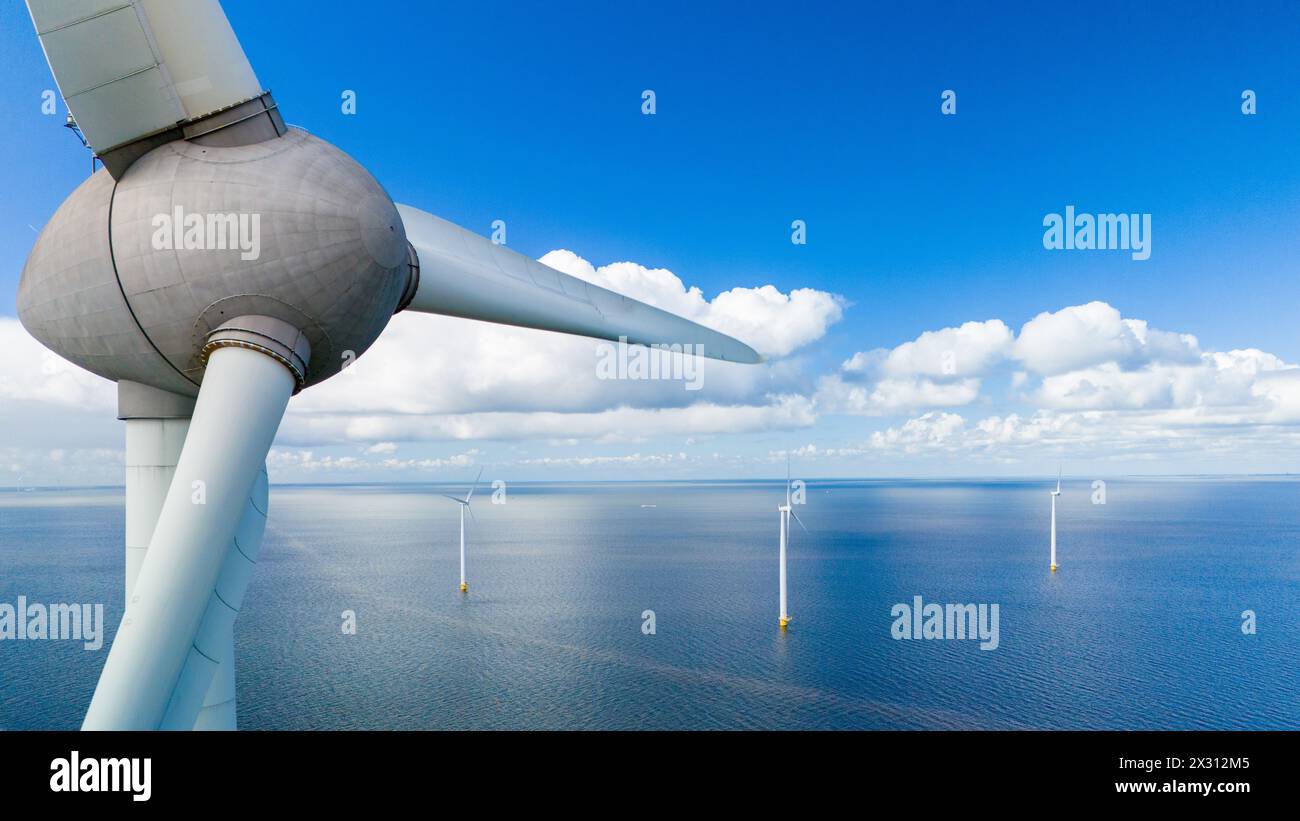 A mesmerizing aerial view of a wind farm in the ocean, with rows of ...
