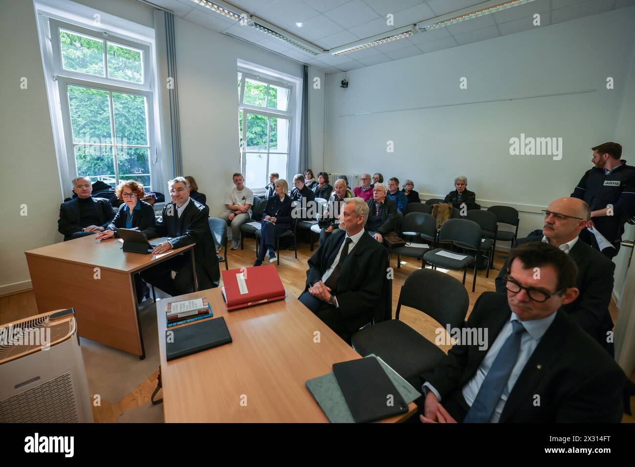 Bonn, Germany. 24th Apr, 2024. Litigants and spectators sit in the ...