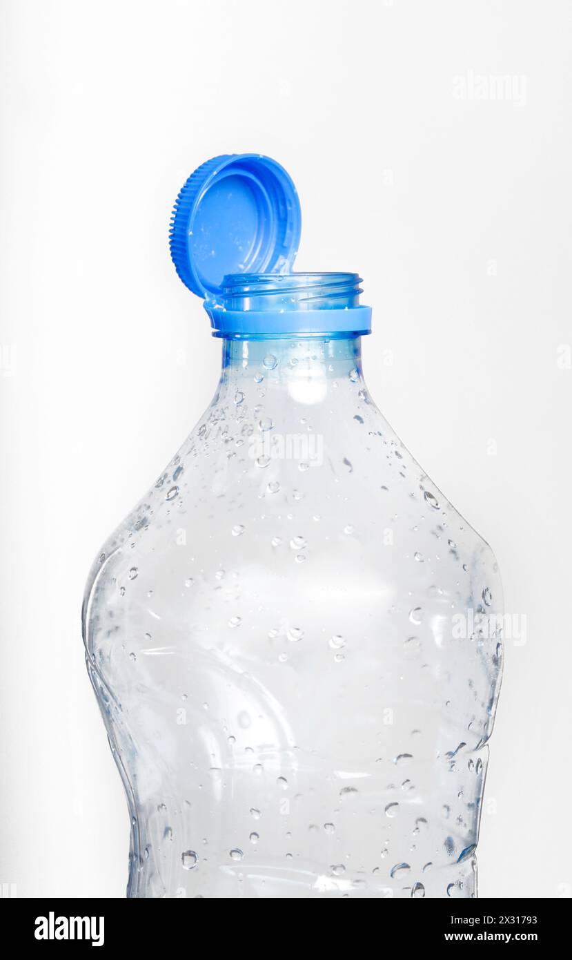 Close up of new cap attached to plastic bottle, connected to the neck ...