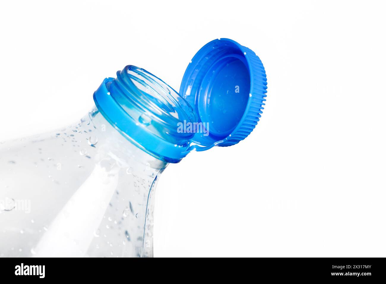 Close up of new cap attached to plastic bottle, connected to the neck ...