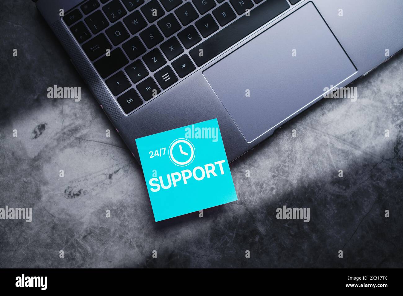 Desktop view of laptop with blue posit for Customer Support 24 hours ...