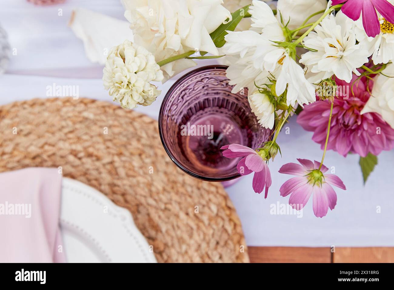 Graceful table setup, artfully arranged flowers. A wedding imbued with ...