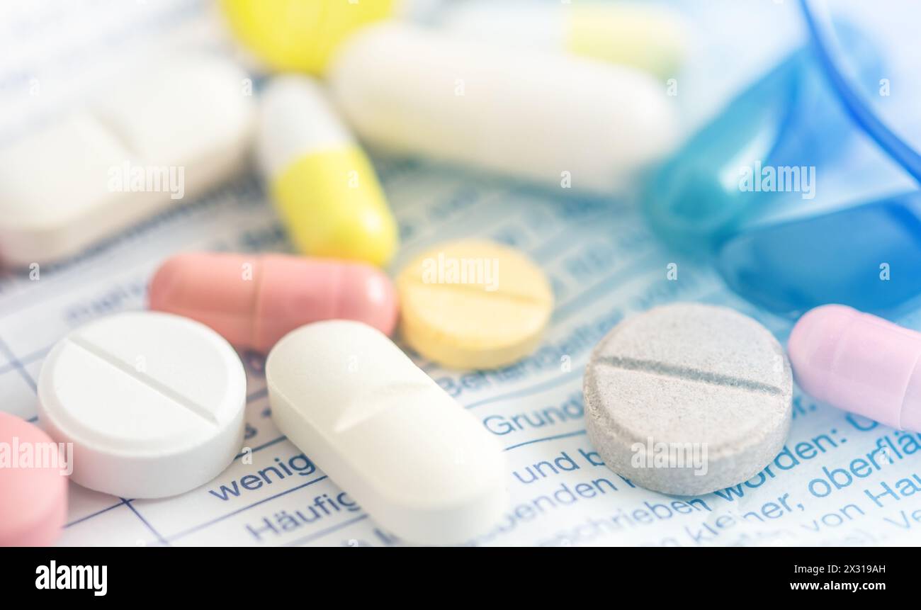Using medicine pills, patient information leaflet Stock Photo - Alamy
