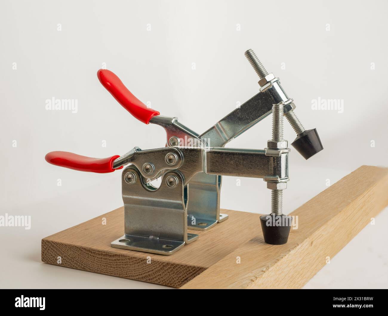 Pair of Metal toggle clamps used for holding down objects isolated on a ...