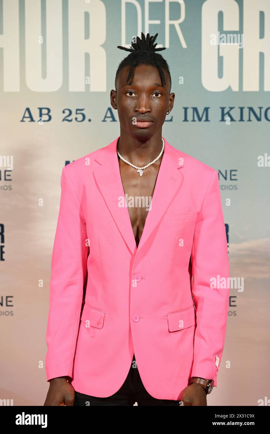Cologne, Germany. 22nd Apr, 2024. Model Yusupha Jobarteh comes to the ...