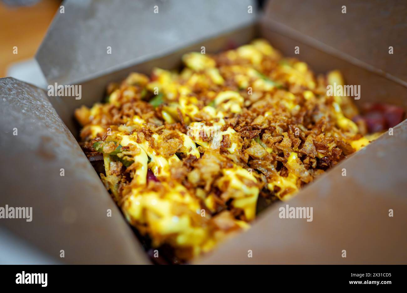 French fry in melted cheese hi-res stock photography and images - Alamy