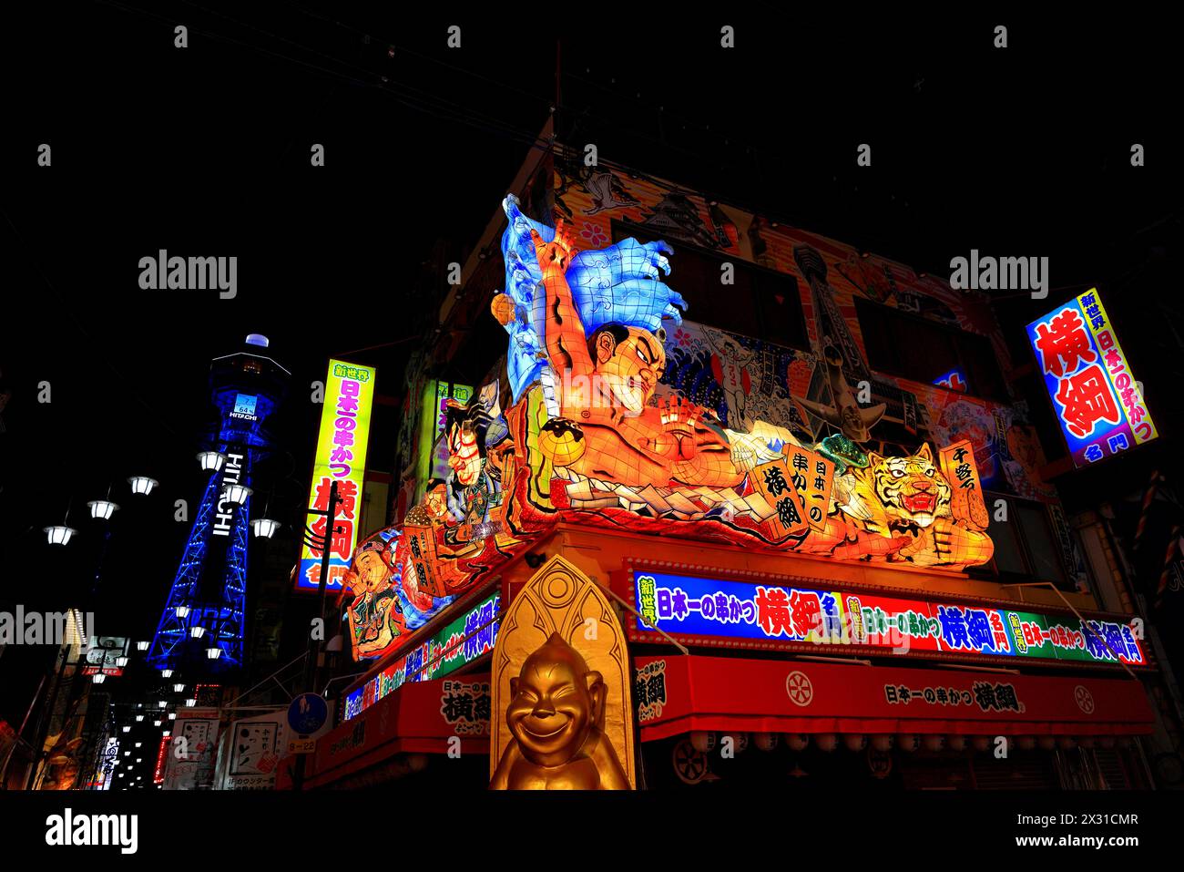 Night view with neon signs and illuminated billboards in Tsutenkaku ...