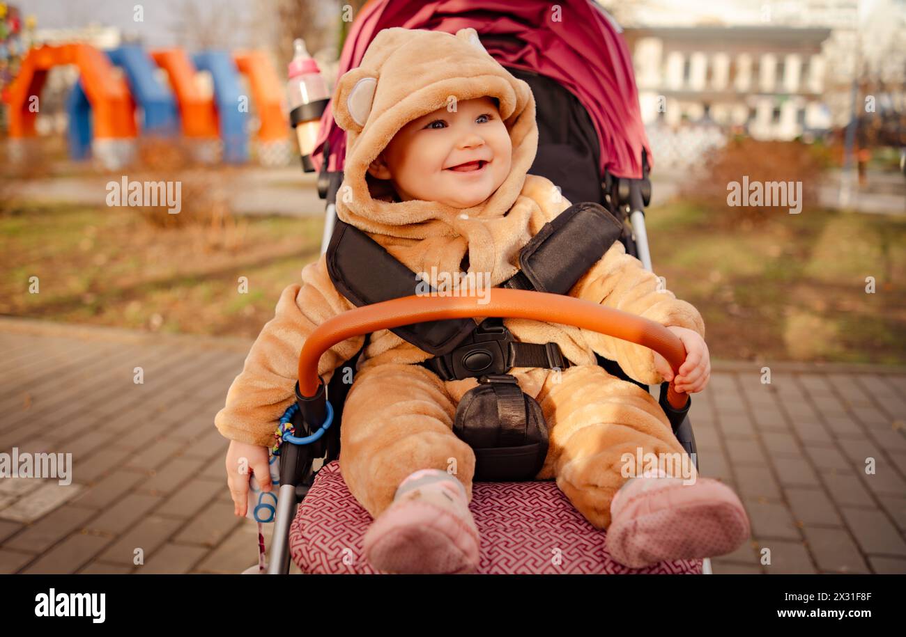 Child in Bear Costume Riding Stroller Stock Photo - Alamy