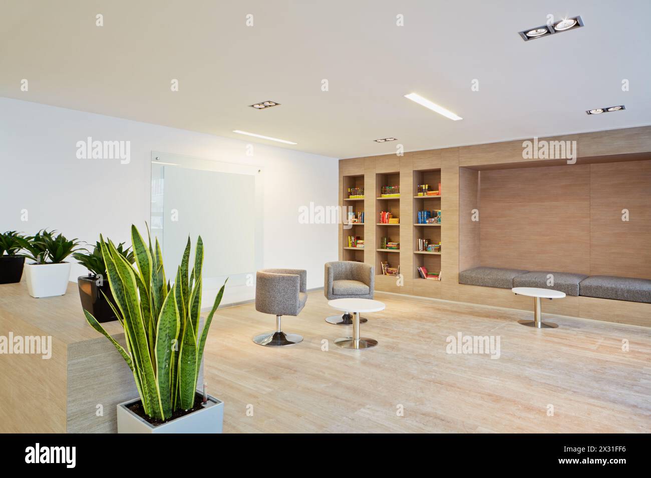 Empty lounge at business center Stock Photo - Alamy