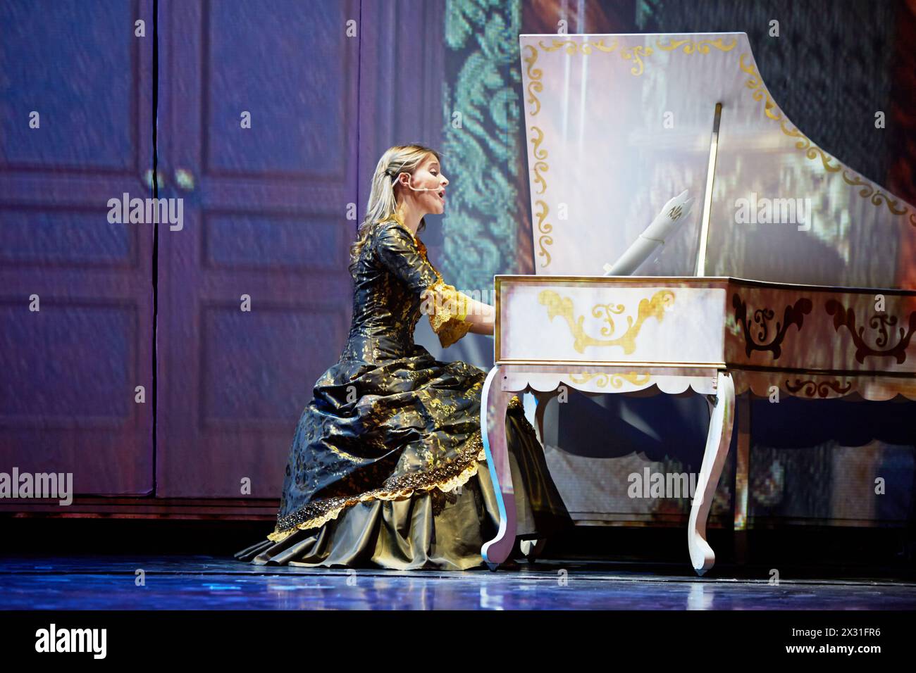 MOSCOW - DEC 15: Actress on stage plays piano and sings during musical ...