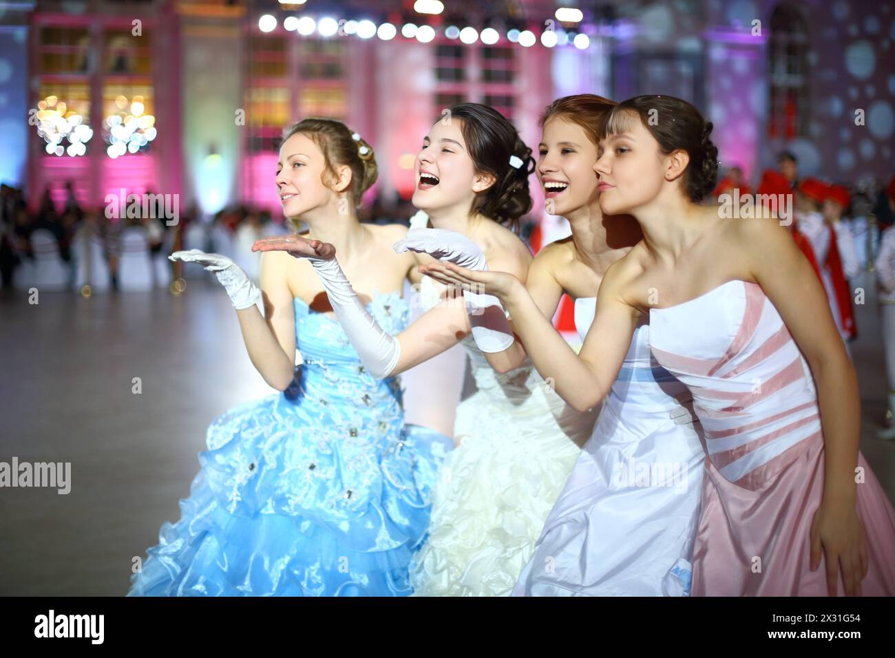 four Cheerful girls sent kisses to the ball Stock Photo - Alamy
