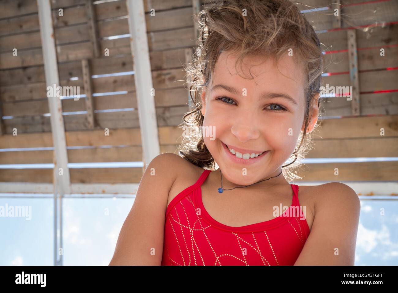 Cute little girl in red swimsuit hi-res stock photography and images - Alamy