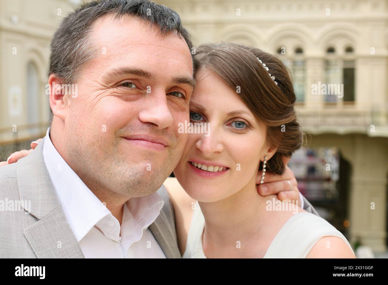 Portrait of a smiling newly married couple hugging each other Stock ...