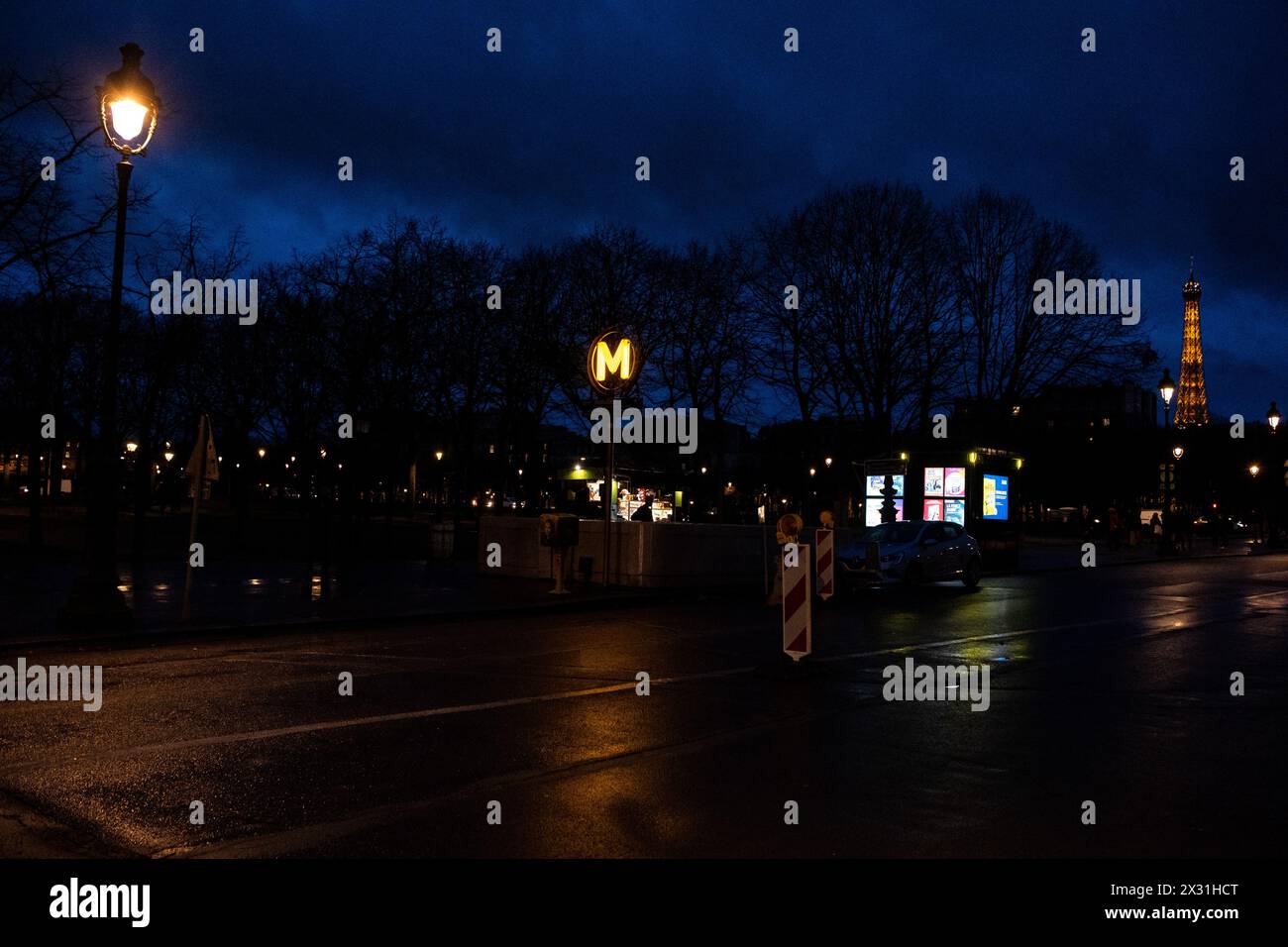 Illuminated sign for the Paris metro on the esplanade des Invalides at ...