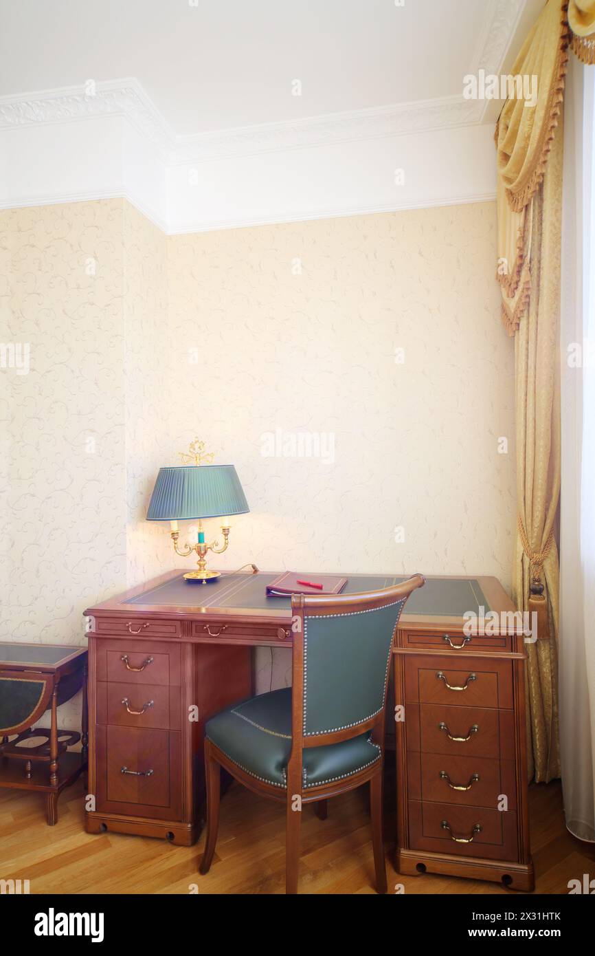 Wooden chair and table with lamp in light room in classic style Stock ...