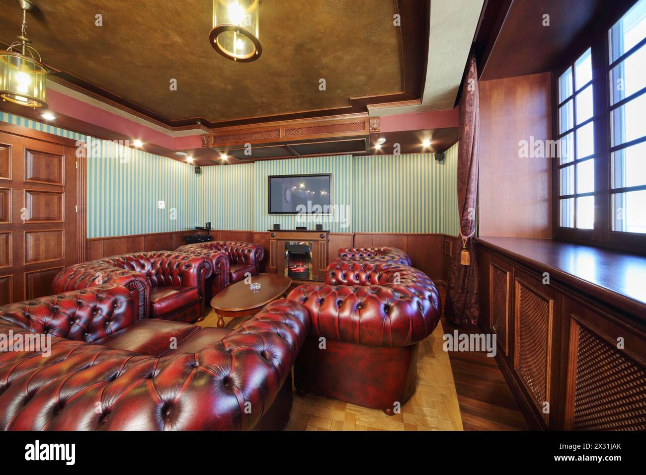 Luxurious english cigar room with leather armchairs and fireplace Stock ...