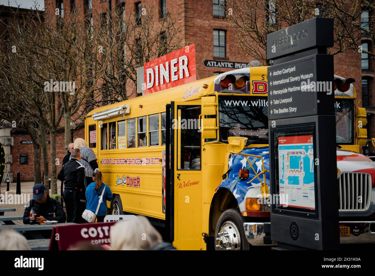 Liverpool, UK, April 11 2024: The yellow bus transformed into a food ...