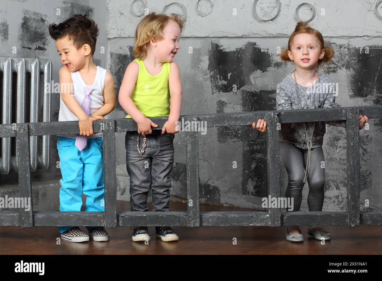 Happy little boys and girl together carry wooden stairs Stock Photo - Alamy