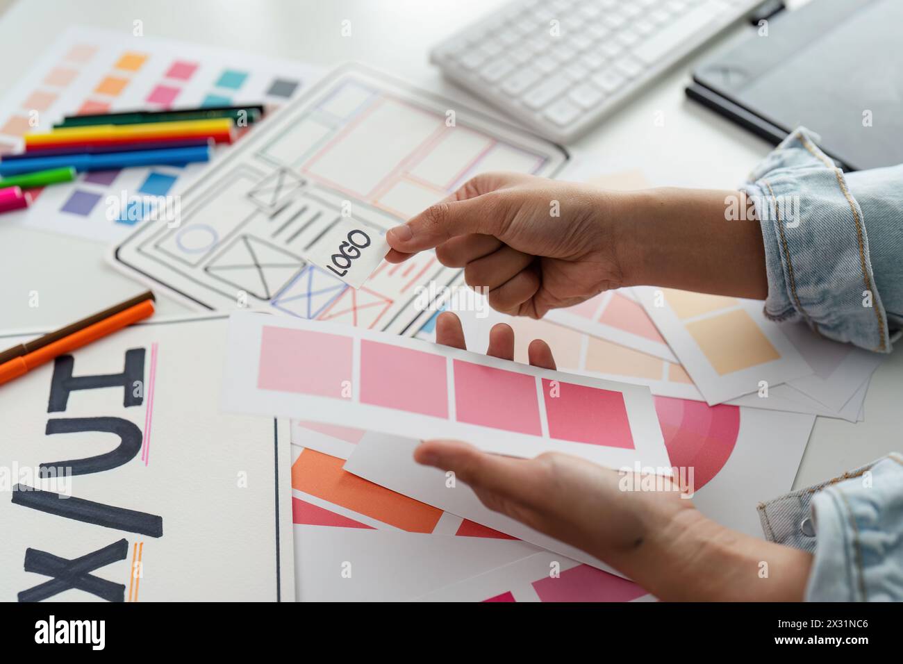 UI graphic designers work on laptop computers and graphics. Creative ...